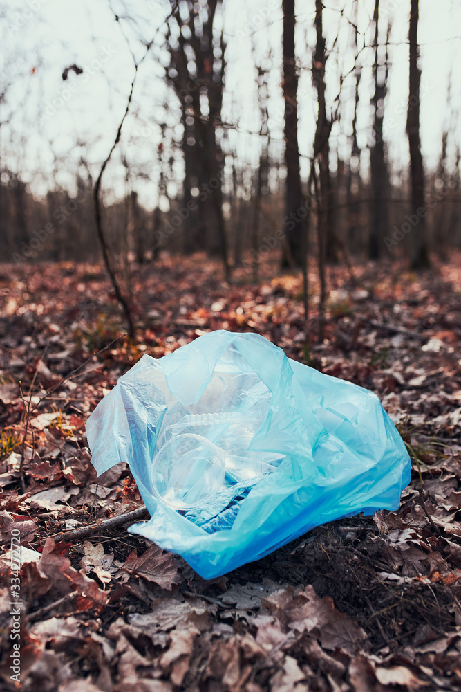 Plastic waste left in forest. Concept of plastic pollution and ...