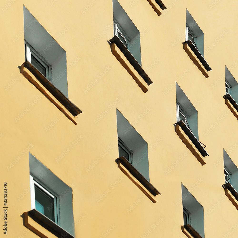 Yellow building with windows. Minimalism in architecture. Yellow ...