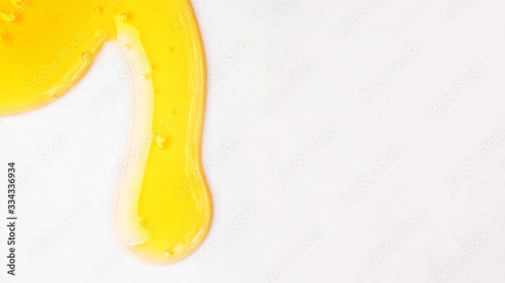 Yellow serum or olive oil drop texture isolated on white background ...