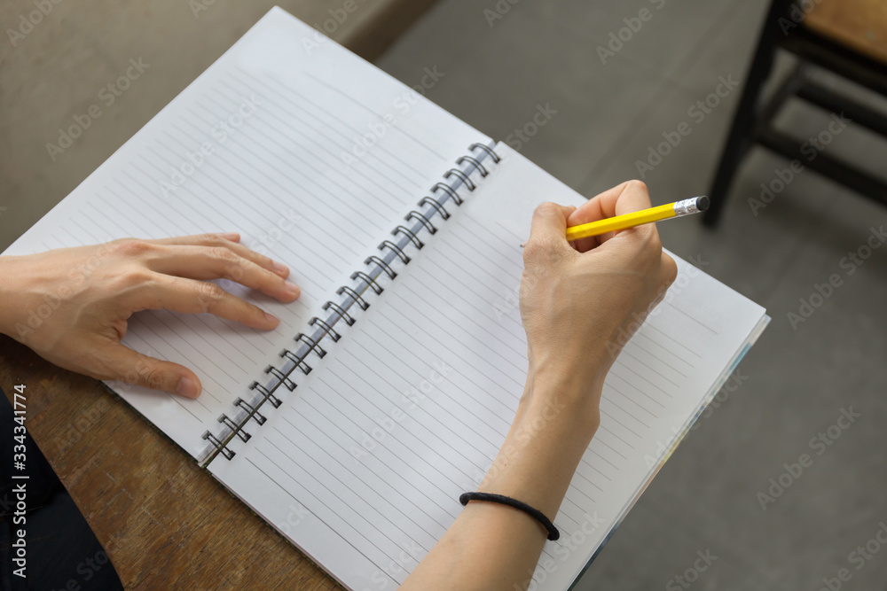 high school,university student study.hands holding pencil writing paper ...