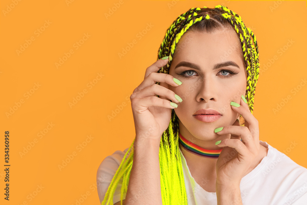 Portrait of young transgender woman on color background Stock Photo ...
