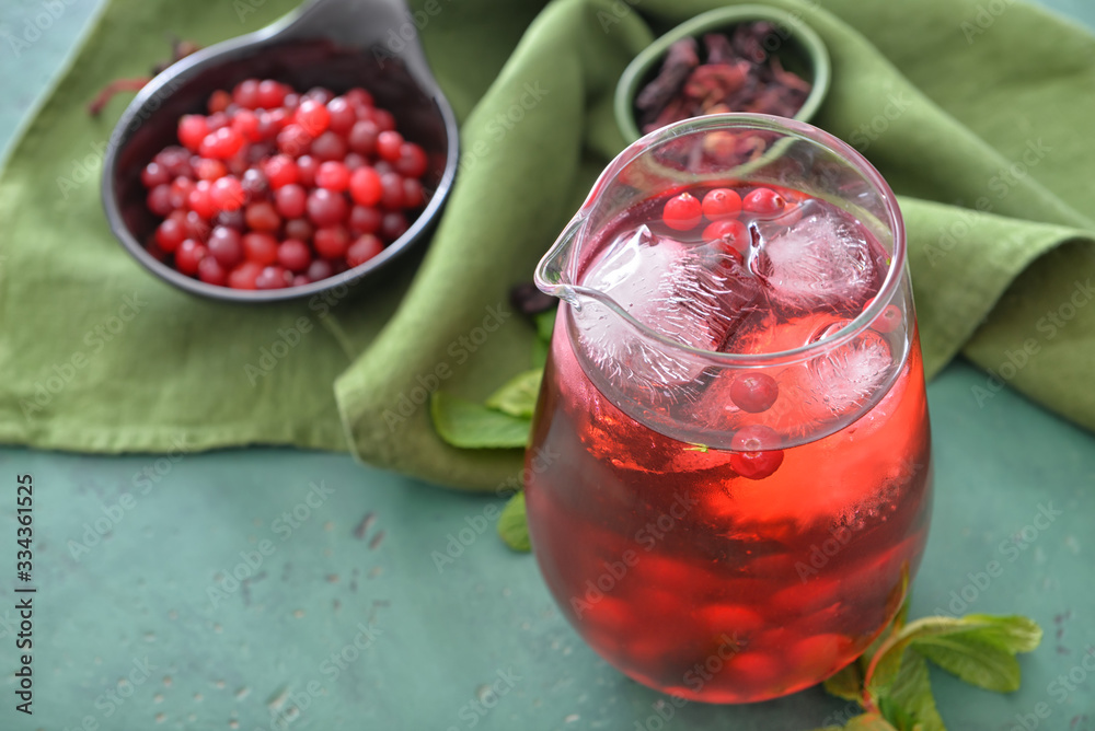 Jug of tasty cold tea on color background Stock Photo | Adobe Stock