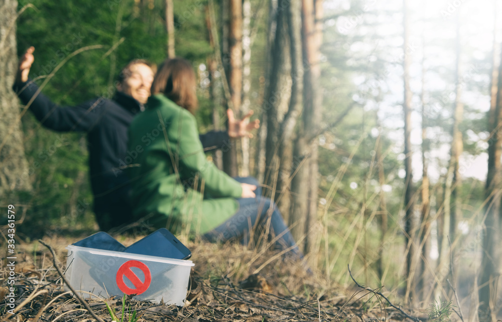 Digital detox concept. Couple spend time together in nature without ...