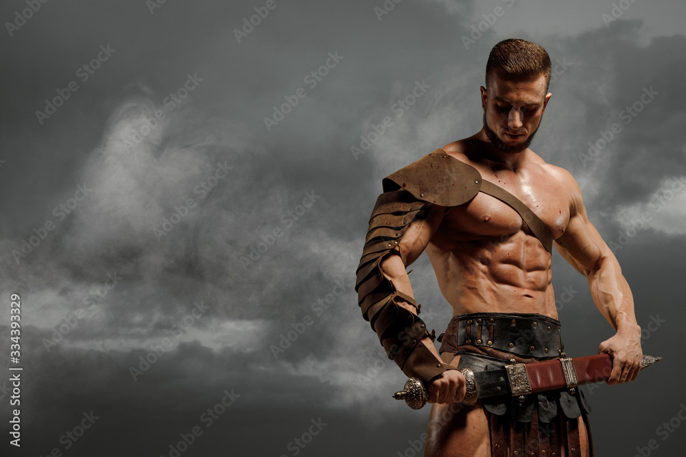 Rome gladiator attacking on dramatic outdoor nature. Ancient warrior ...