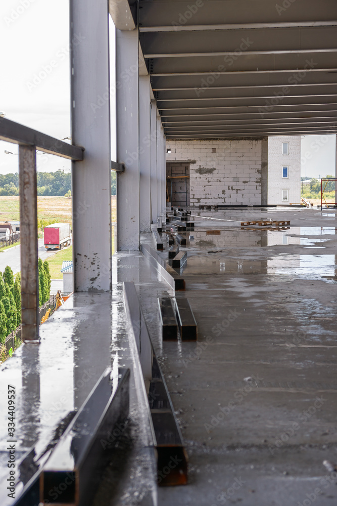 Big square metal pipes parts under rain on construction with sky in ...