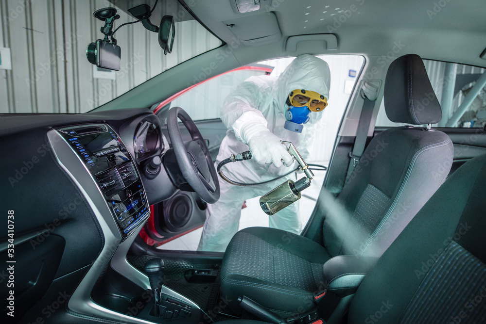 Clean surfaces in car with a disinfectant spray. Help kill coronavirus ...