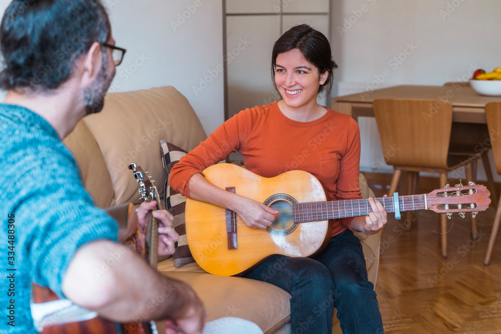 Unrecognizable music teacher explaining correct position instruction to ...