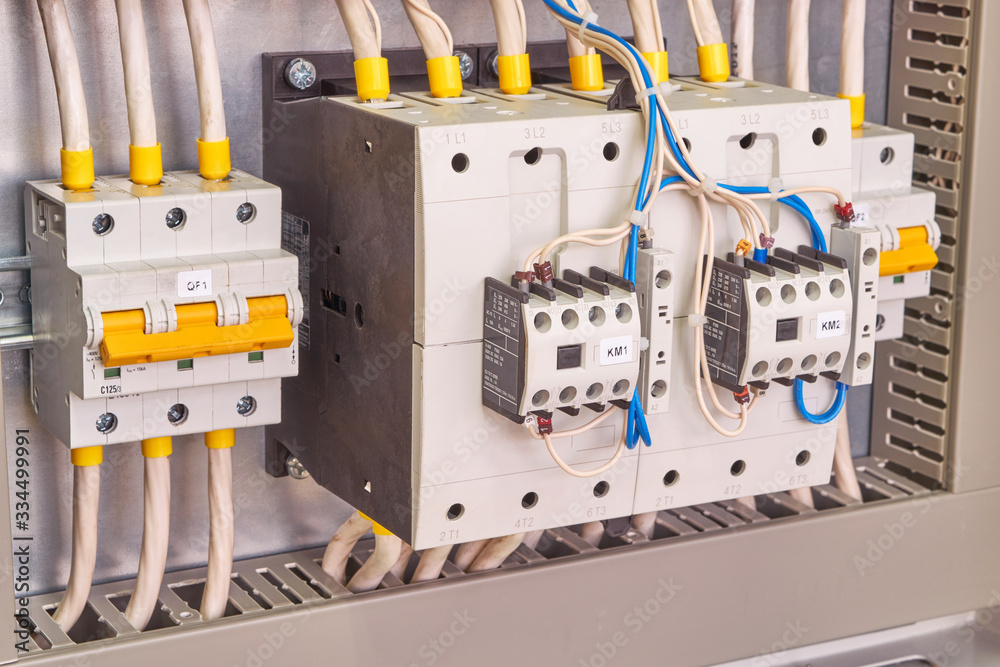 Two powerful power contactors with front additional contacts and two ...