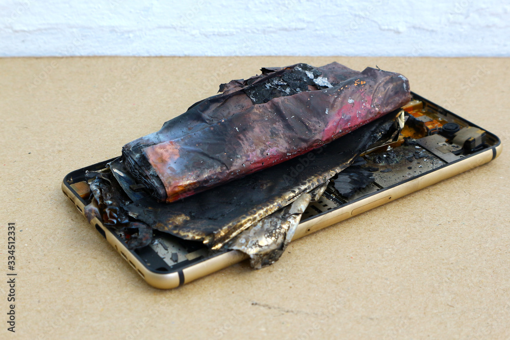 Smartphone battery close up. Explode on brown paper background. Stock ...