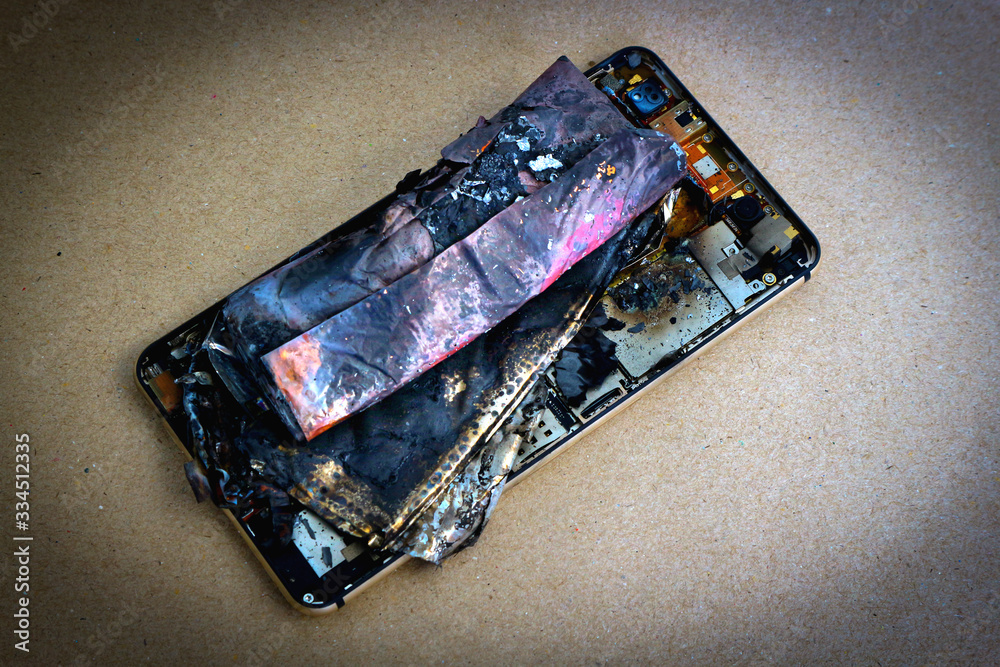 Smartphone battery close up. Explode on brown paper background. Stock ...