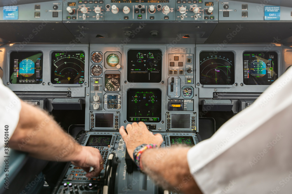 Cockpit view of an airplane in flight Stock Photo | Adobe Stock