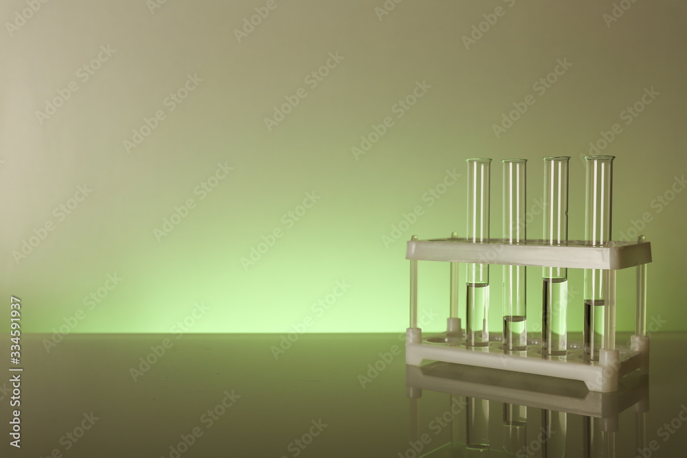 conceptual background with chemical flasks. green backdrop with lab ...