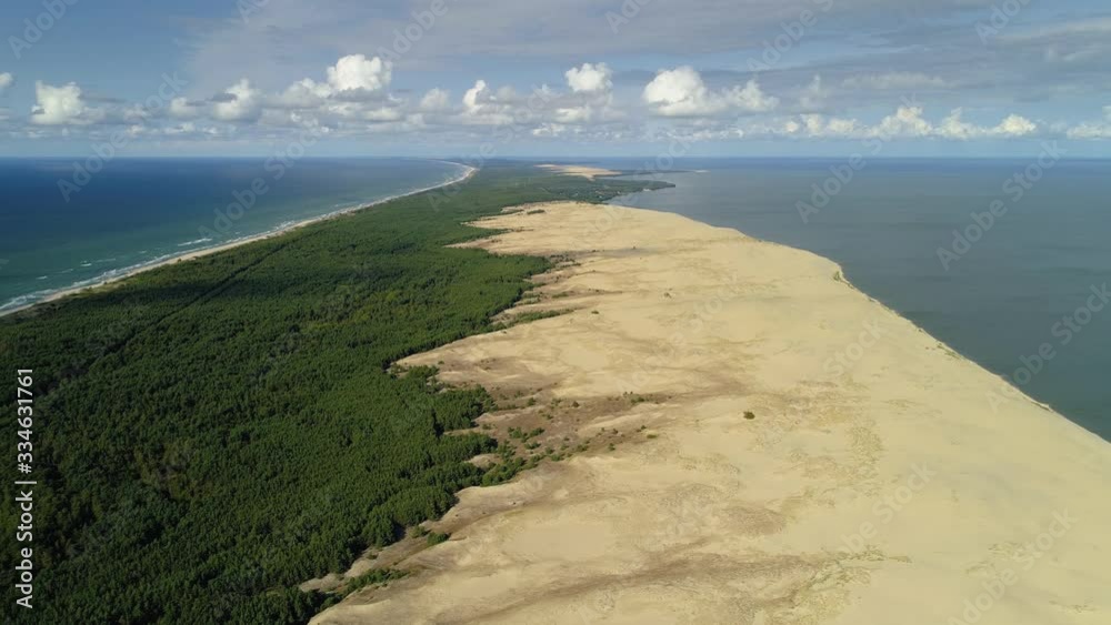 Flight above sand spit dunes Kaliningrad region. Long strip artificial ...