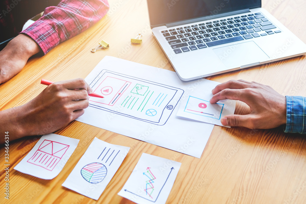 close up male asian ui/ux designers working and designing a user ...