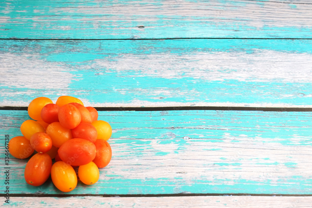 Variety colored of tomato cherry on top wooden table. Tomato cherry is ...