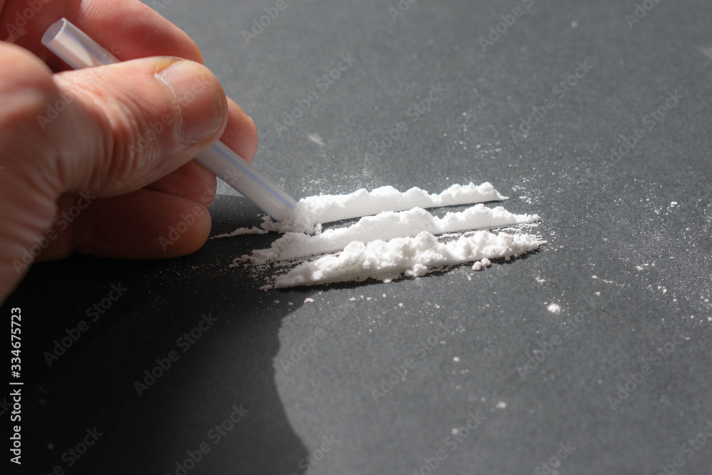 Snorting a line of cocaine Stock Photo | Adobe Stock