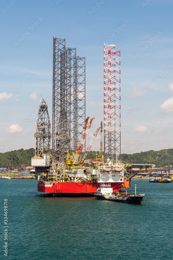 Jack-up drilling rig supporting oil and gas industry anhored inside ...