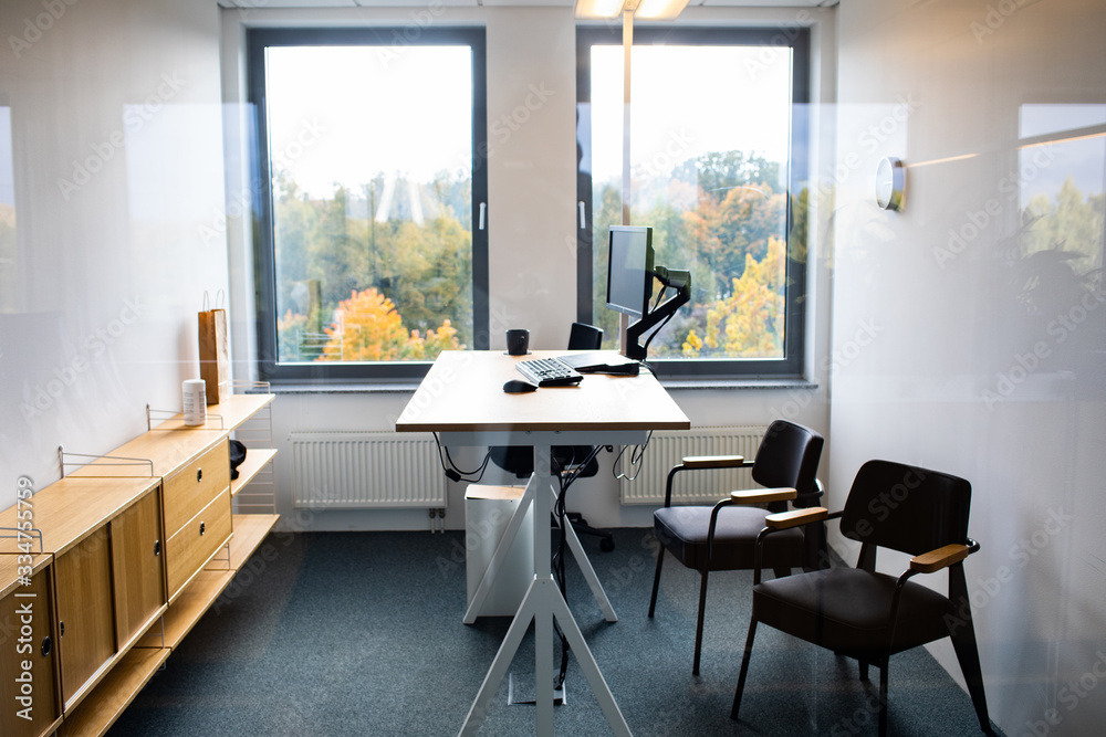 Modern interior of office. A stand up desk with desktop computer in ...