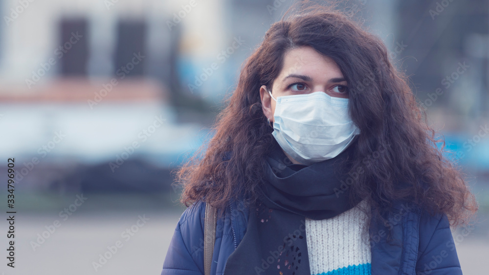 Close-up portrait young europeans woman in protective disposable ...