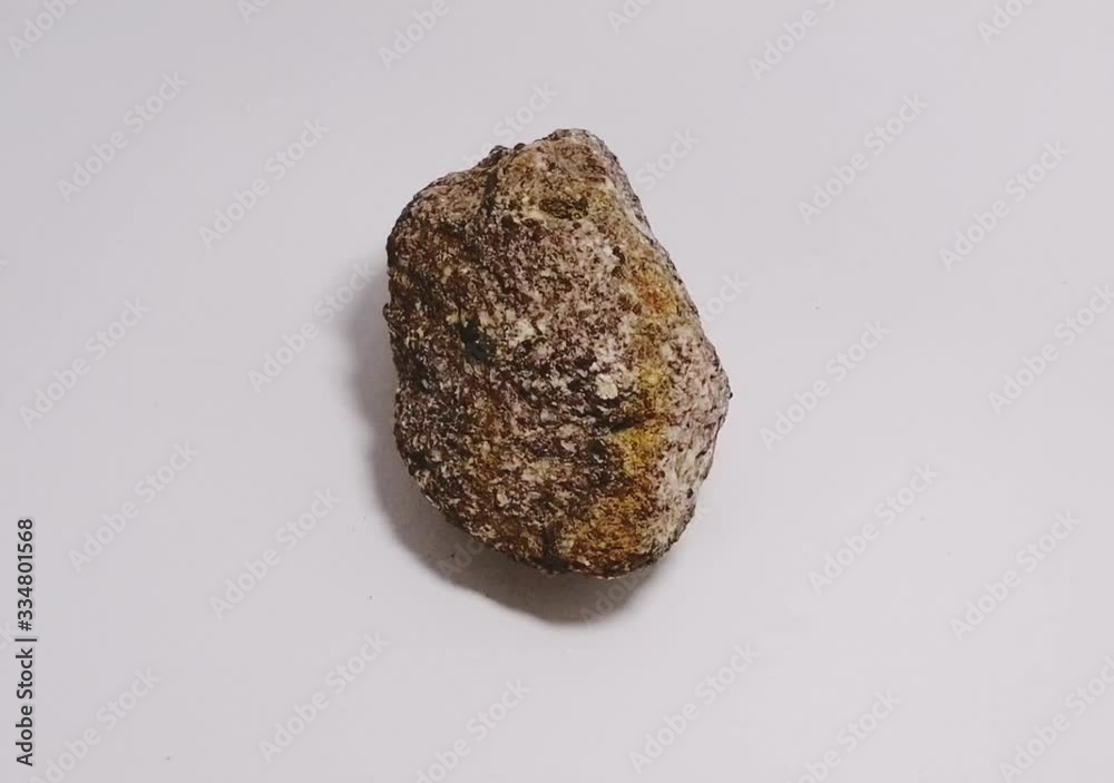 Conglomerate specimen on white background. Conglomerate is a ...