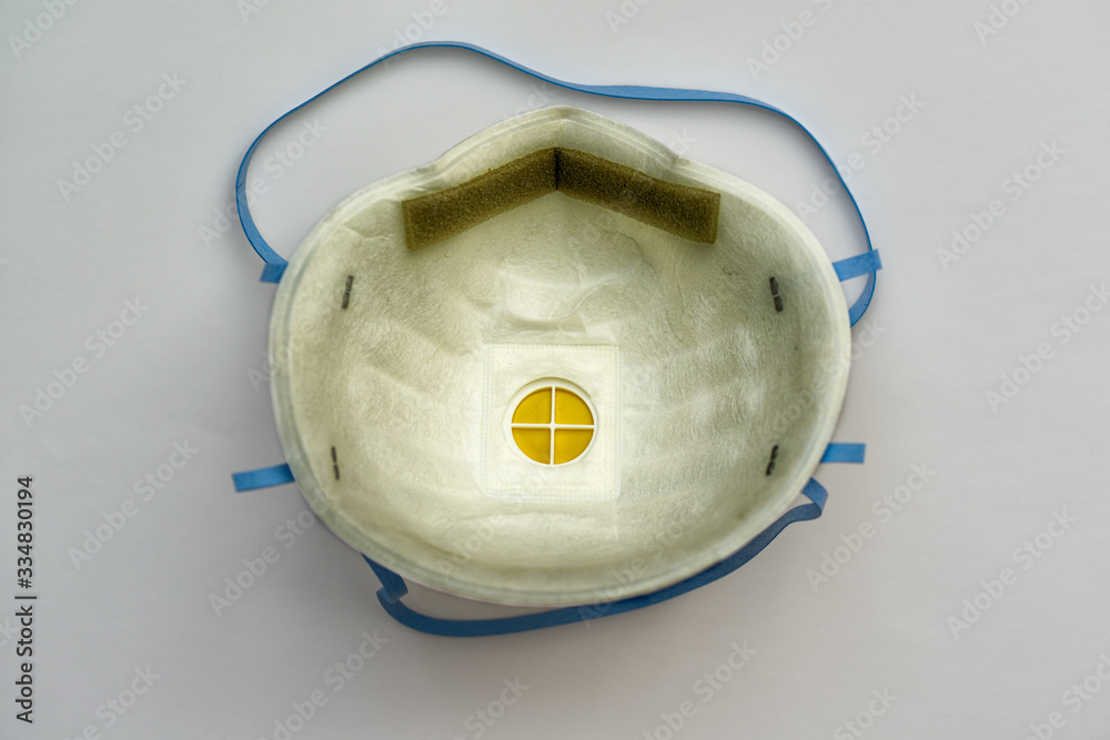 Interior side of used, dirty FFP2 norm filter mask on white background ...