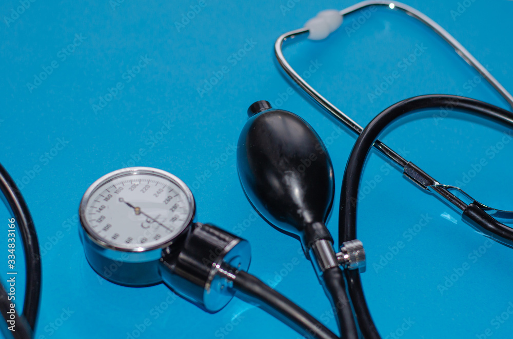 Aneroid blood pressure kit for pressure measurement on a blue ...