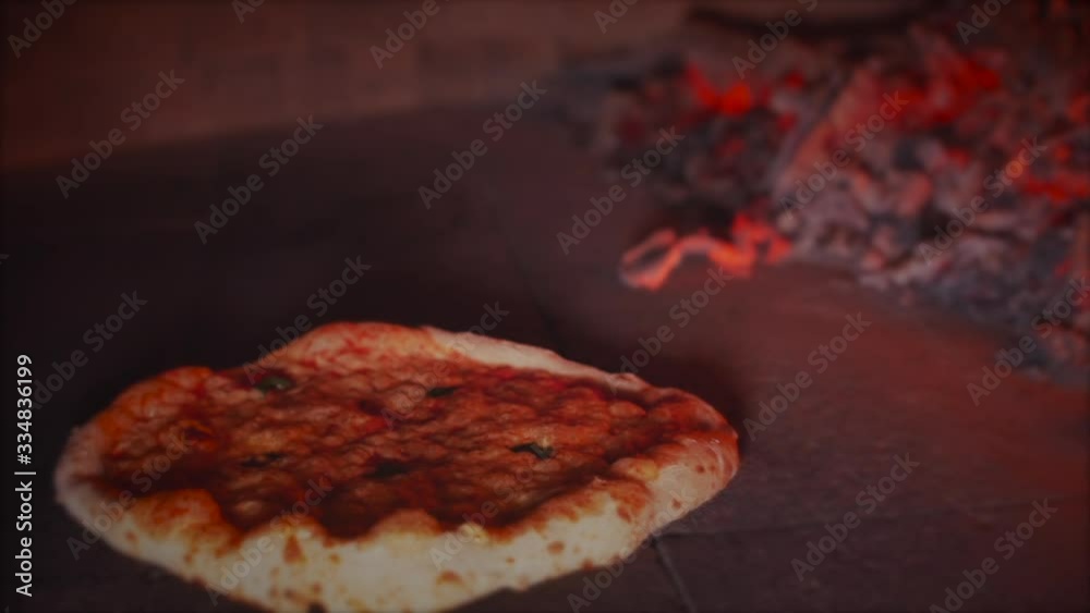 Pizza in the oven. A fire is burning in the oven. Pizza oven. Slow ...