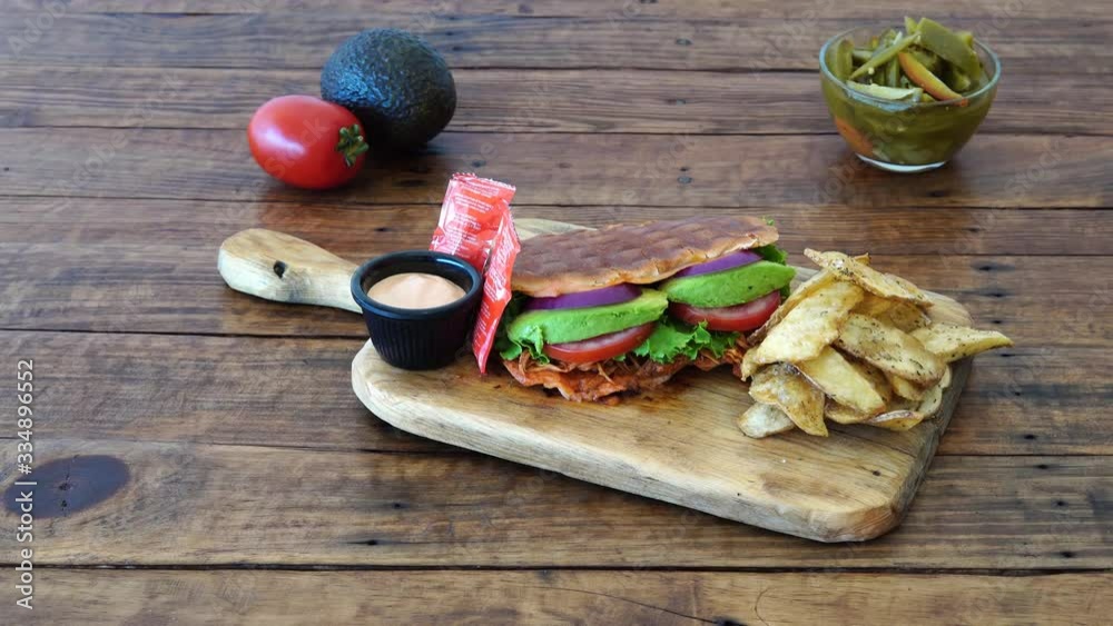 Torta, Pork cake with avocado tomato fries jalapeño peppers and ...
