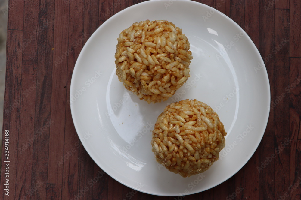 Indian Traditional Puffed Rice Balls is a sweet made using puffed rice ...