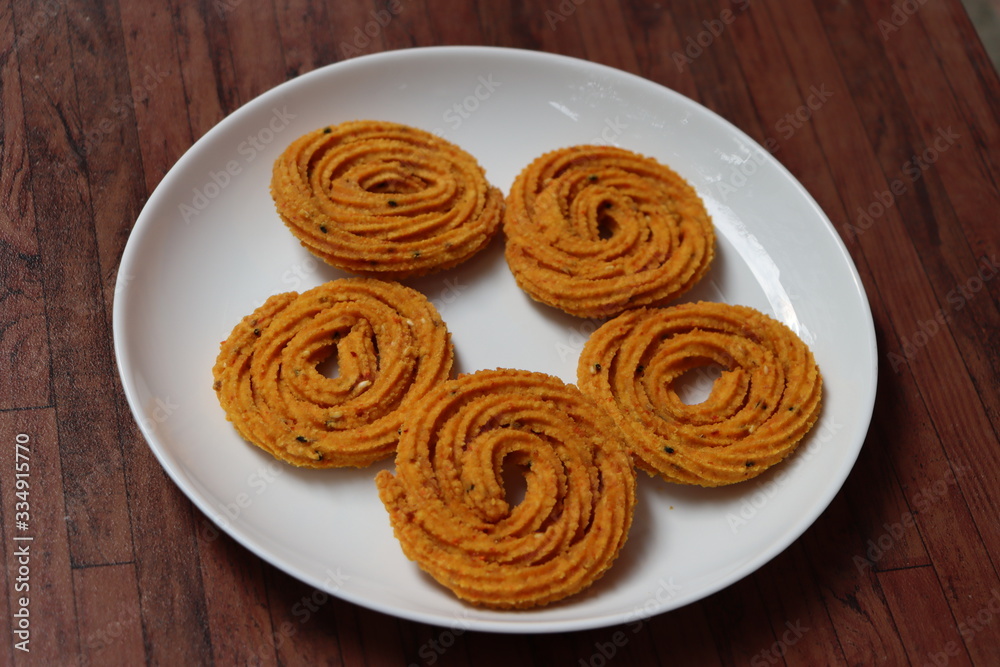 Indian Traditional Snack Chakali, a spiral shaped crisp deep fried ...