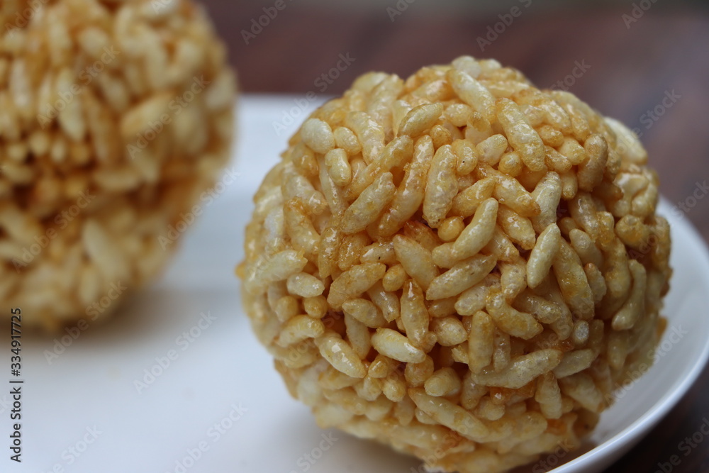Indian Traditional Puffed Rice Balls is a sweet made using puffed rice ...