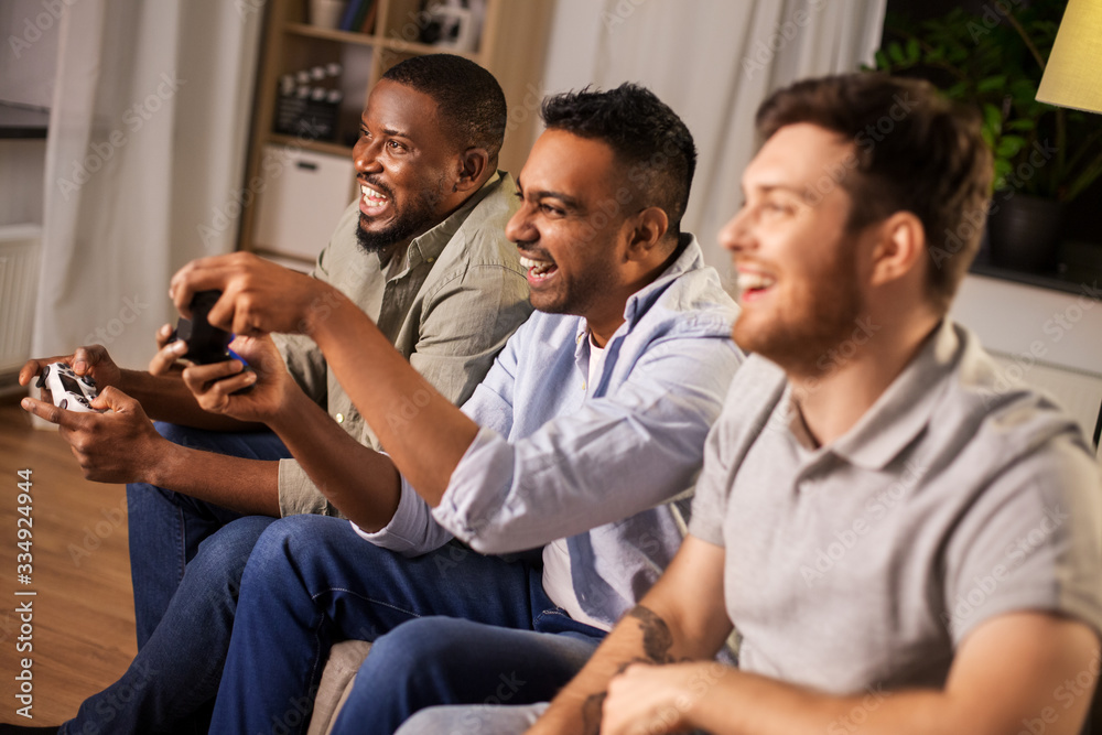 friendship, technology and leisure concept - smiling male friends with ...