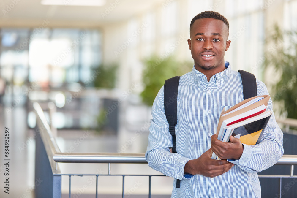 Happy african man as student Stock Photo | Adobe Stock