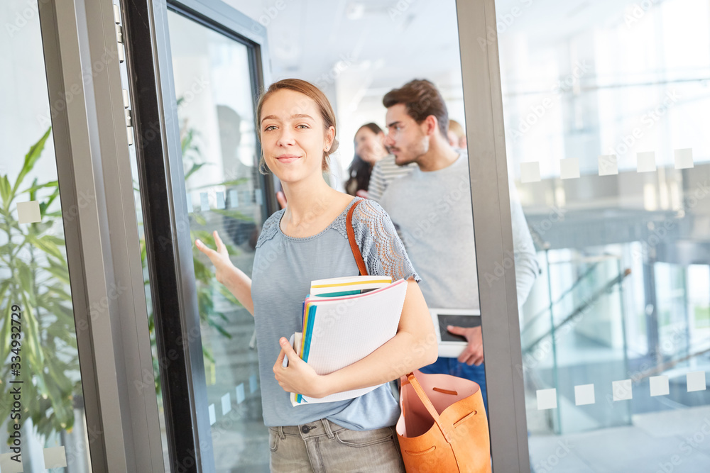 Woman as freshmen student in the uni Stock Photo | Adobe Stock
