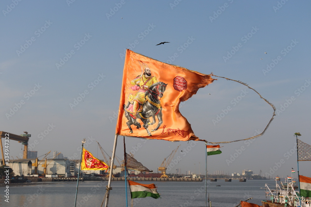 Mumbai, Maharastra/India- March 31 2020: Waving saffron flag of the ...