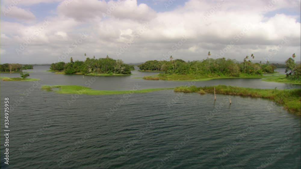 Aerial view of Lake Bayano, small islands with palms and cloud forest ...
