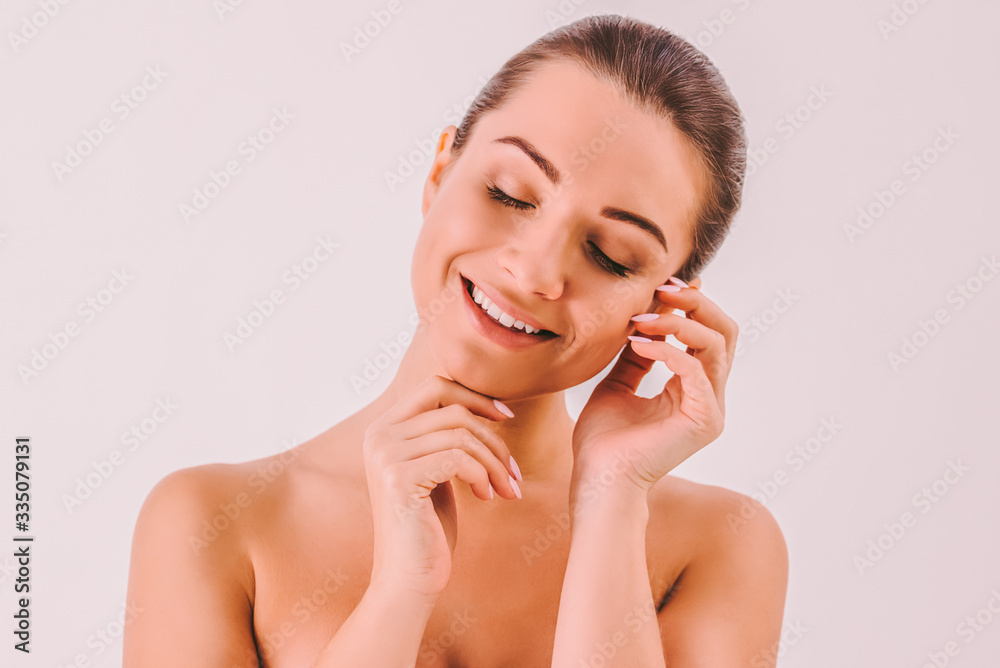 Happy attractive girl beauty model with perfect smooth skin touch face ...