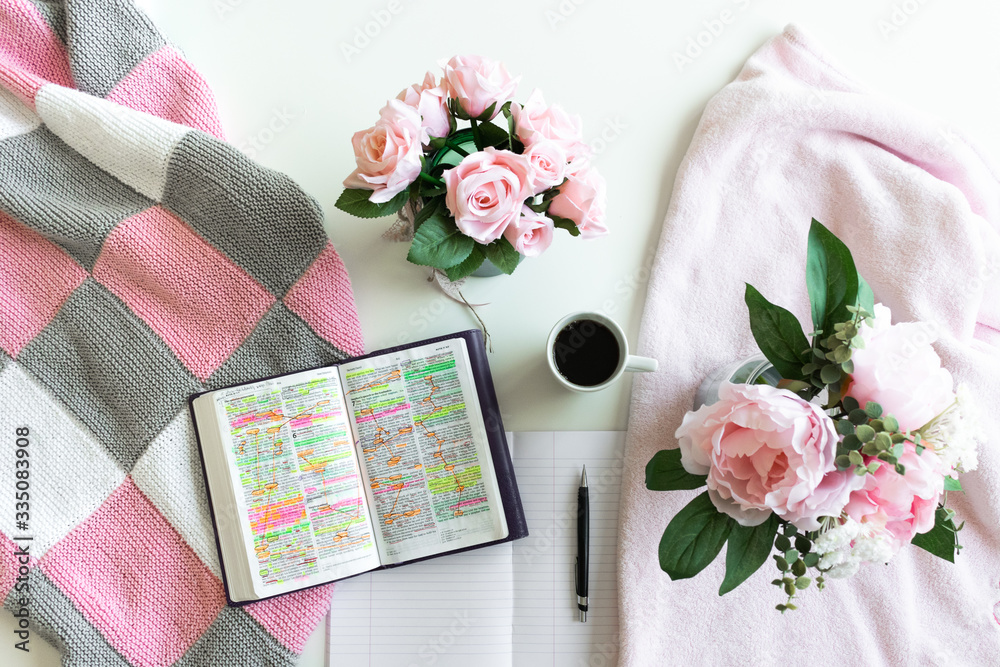 Pink Bible flat lay: Bouquet of pink roses, open Bible with highlighted ...