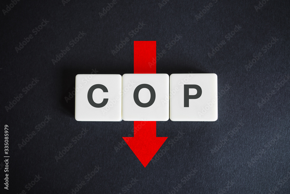 Colombian peso alphabetic currency ISO code (COP) and down red arrow on ...