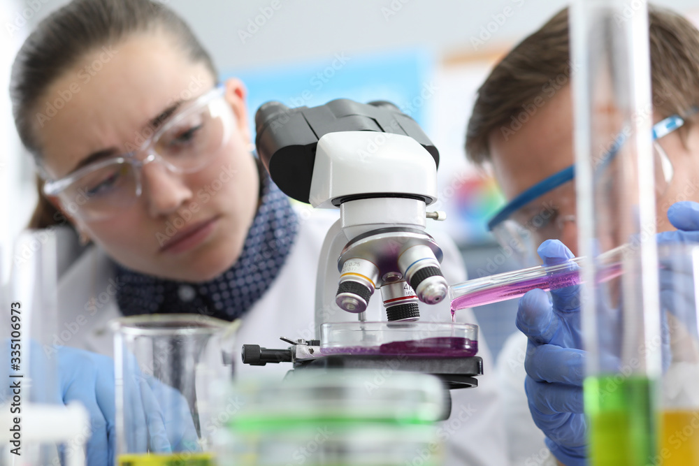 People look at reaction liquid under microscope. Analytical data ...