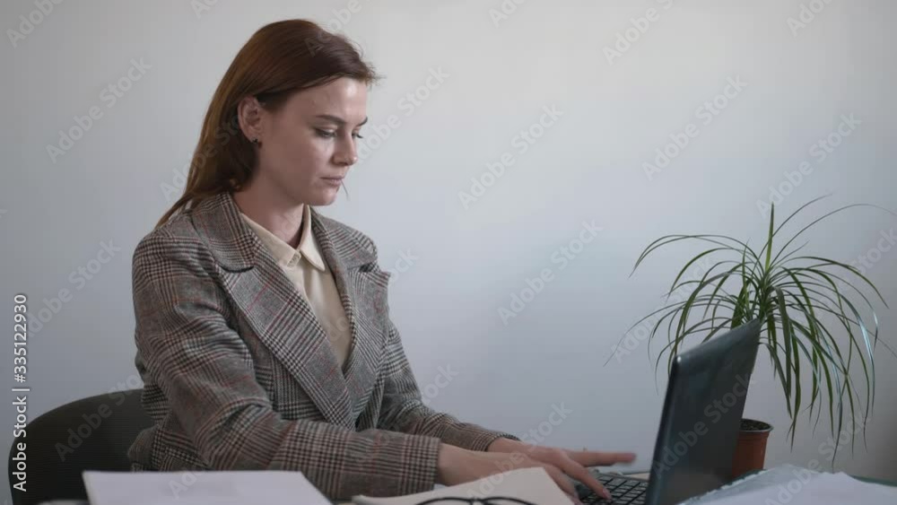 upset woman feels back pain while massaging muscle pain, sad female ...