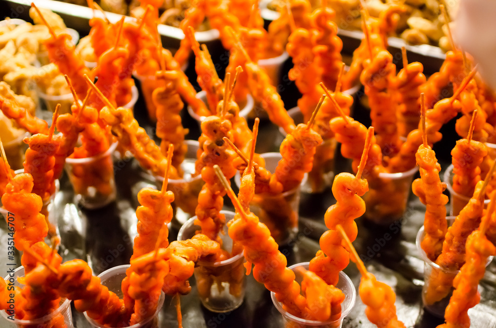 Assorted street food in bright orange colors Stock Photo | Adobe Stock