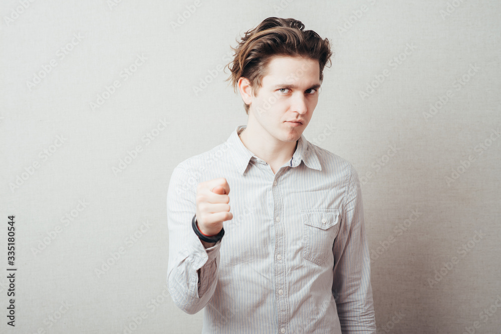 Closeup portrait happy young man giving thumb, finger fig gesture you ...