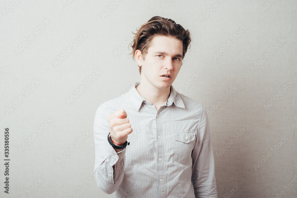Closeup portrait happy young man giving thumb, finger fig gesture you ...