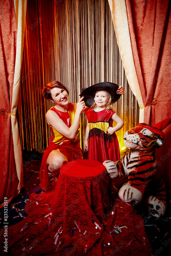 Family during a stylized theatrical circus photo shoot in a beautiful ...