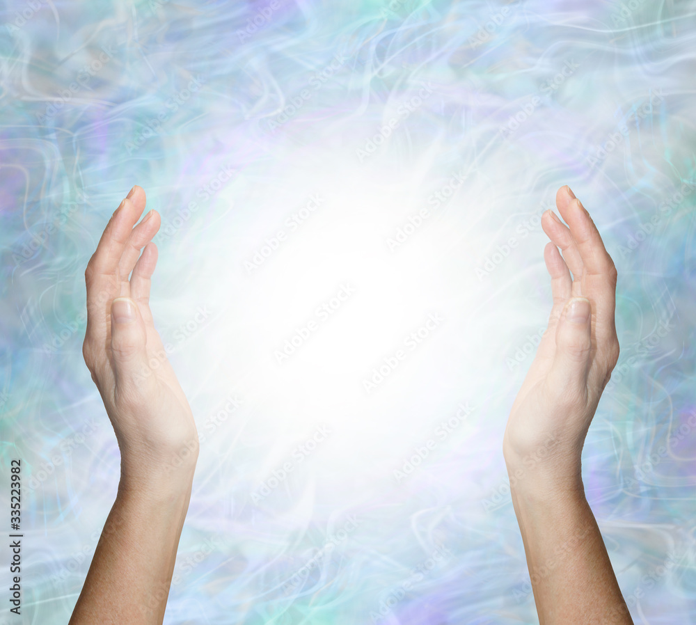 Working with spiritual healing energy - female hands 30cm apart ...