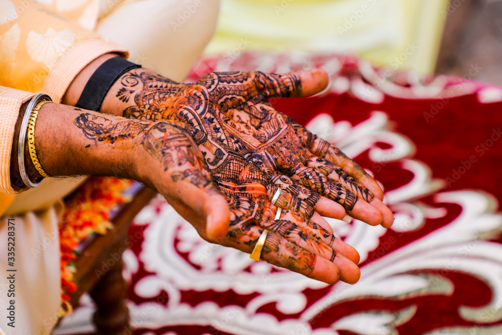 Indian wedding ceremony : groom hand with mehandi design Stock Photo ...