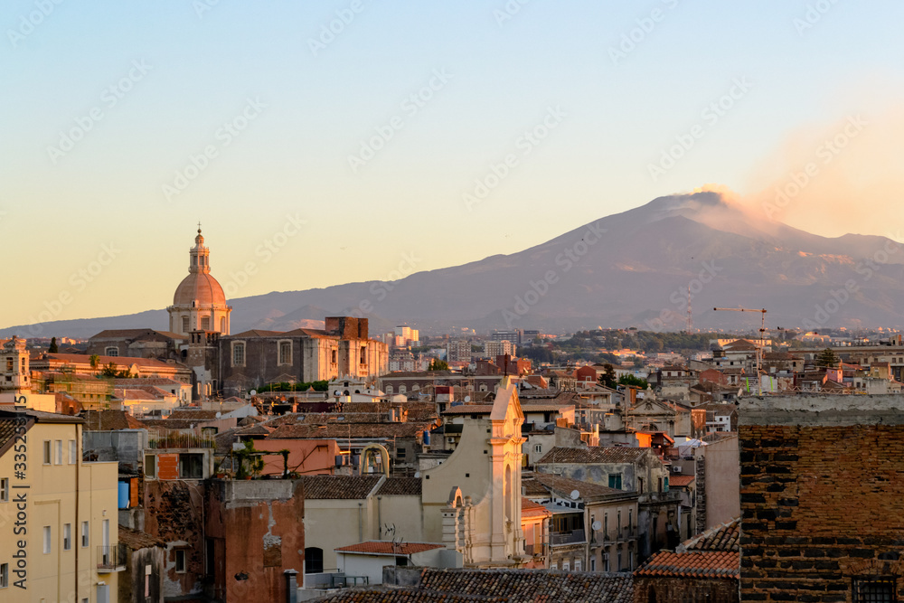 Catania, Sicily in Italy. Aerial view of the city roofs at sunset with ...
