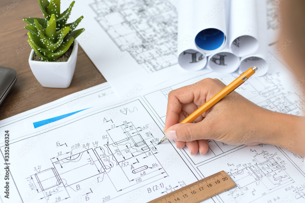 Architect sketching a construction project, view from the top ...