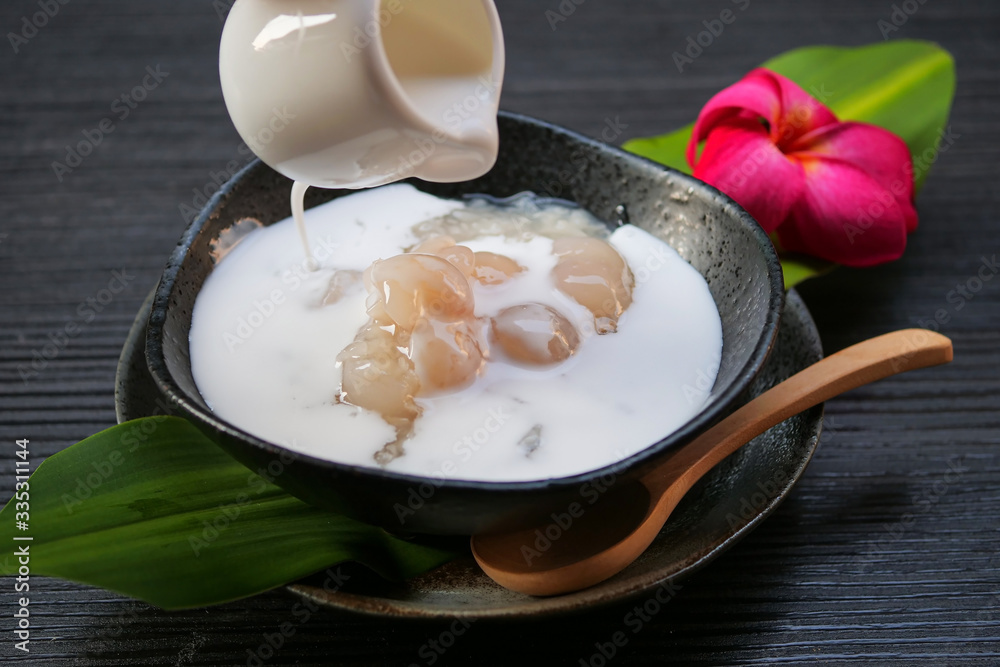 Sticky rice boiled in syrup with longan and coconut milk dressing. Thai ...